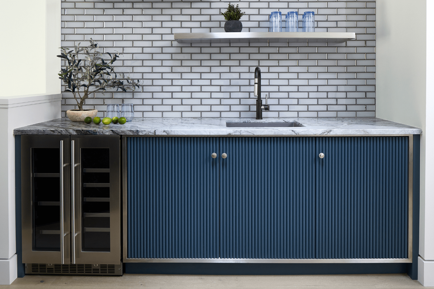 Bold Blue Wet Bar with Reeded Doors in Luxurious Carriage House ...