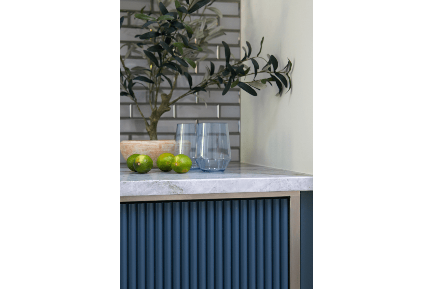 Bold Blue Wet Bar with Reeded Doors in Luxurious Carriage House ...